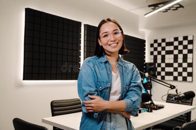Happy Young Female Radio Host Smiling while Broadcasting in Studio ...