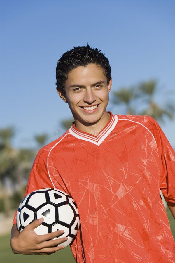 Happy Player Holding Football Stock Image - Image of outdoors, practice ...