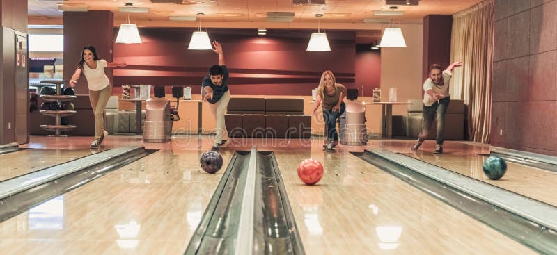 Friends playing bowling stock image. Image of happiness - 100980191