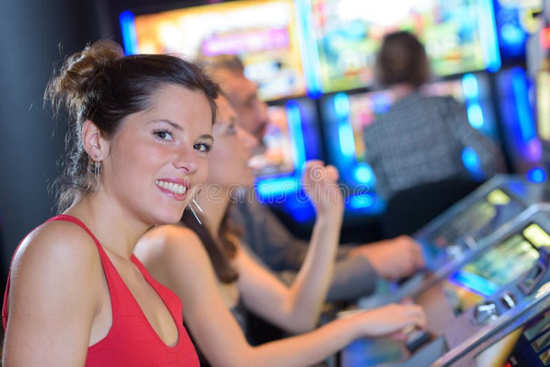 Happy Young Friends Having Fun Together with Slot Machine Stock Photo ...