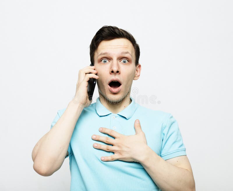 Happy Young Gesturing and Smiling while Talking on the Mobile Phone ...