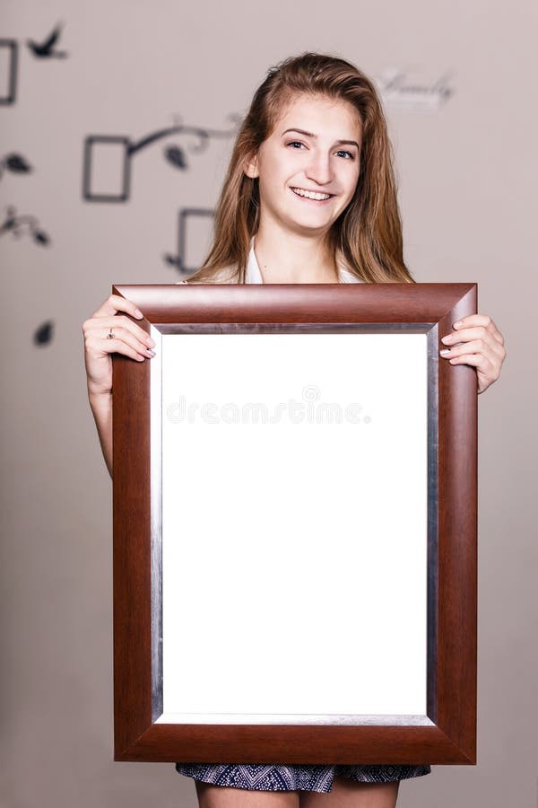 Happy Young Girl Holding Portrait Frame Stock Photo - Image of ...