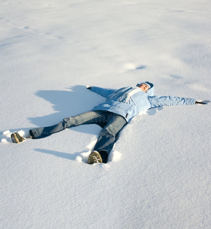 Happy Young Girl Lying in the Snow Stock Image - Image of activities ...