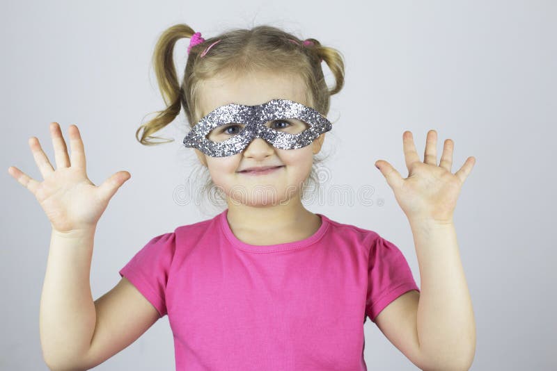 Happy Young Girl in Mask Makes a Grimace Stock Image - Image of hands ...