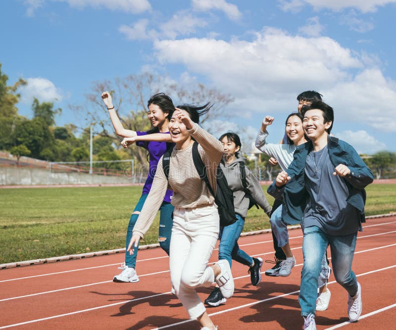 Happy Graduation Students Holding Diploma and Running on the Stadium at ...