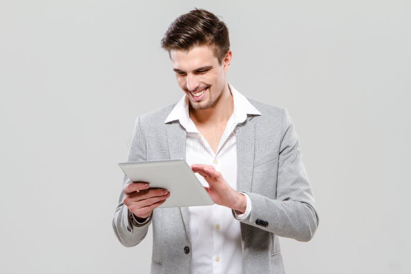 Happy Young Guy Using Tablet Stock Photo - Image of business, positive ...