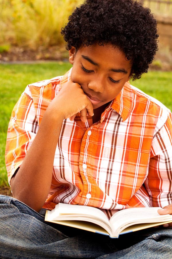 Happy Young Kid Smiling and Reading. Stock Photo - Image of people ...
