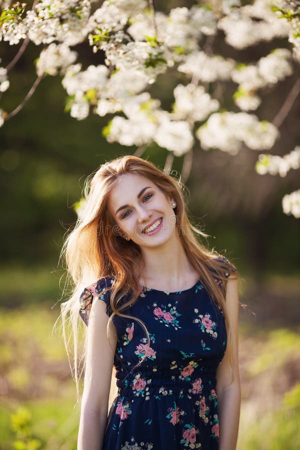 Happy Young Lady Standing in Blooming Tree Stock Photo - Image of ...