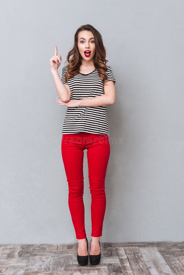 HAppy Young Lady Standing Over Grey Wall Have an Idea Stock Photo ...