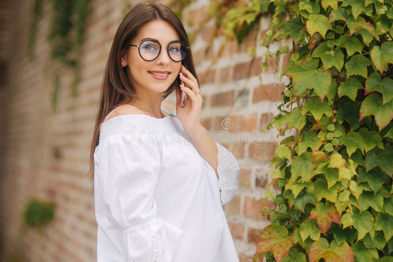 Happy Young Lady Talking on Mobile Phone on the Street Stock Photo ...