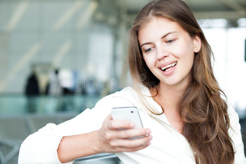 Lovely Young Woman Looking on Mobile Phone in Shopping Center Stock ...
