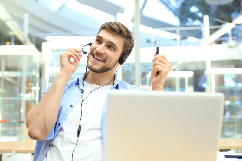 Happy Young Male Customer Support Executive Working in Office Stock ...