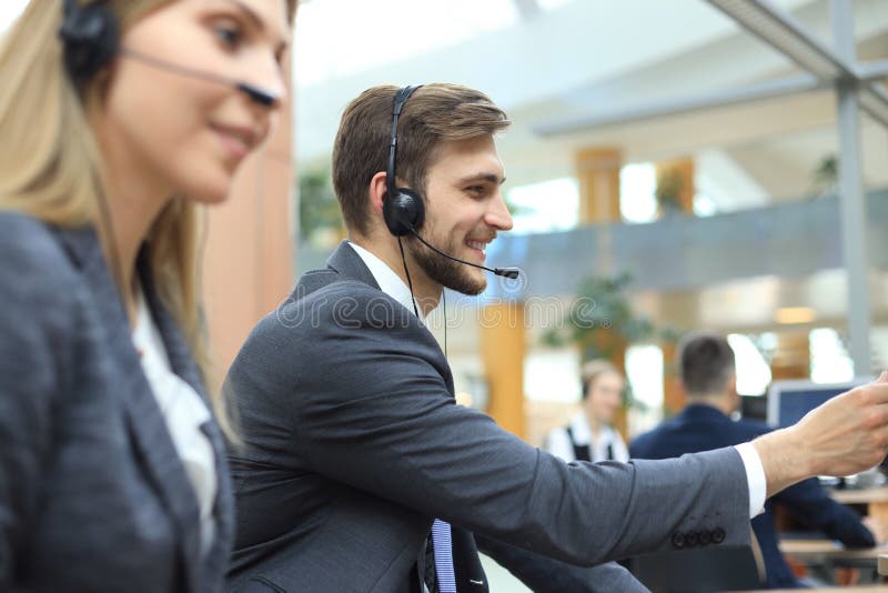 Happy Young Male Customer Support Executive Working in Office Stock ...