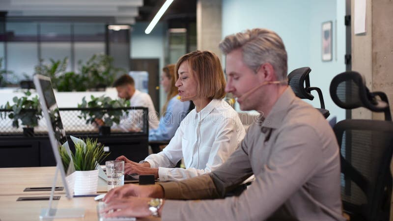 Happy Young Male Customer Support Executive Working in Office. Stock ...