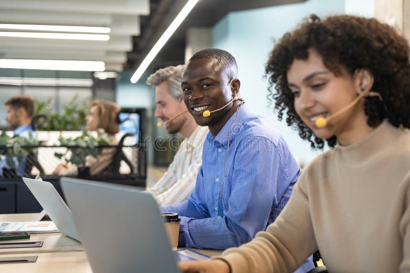 Happy Young Male Customer Support Executive Working in Office. Stock ...