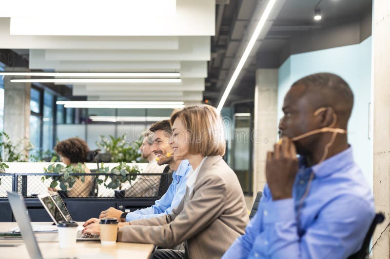 Happy Young Male Customer Support Executive Working in Office. Stock ...