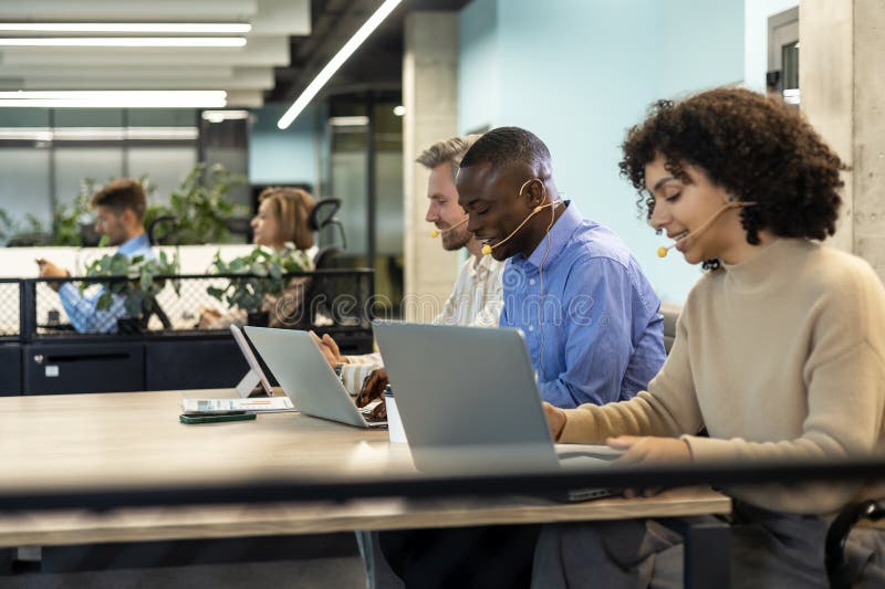 Happy Young Male Customer Support Executive Working in Office. Stock ...