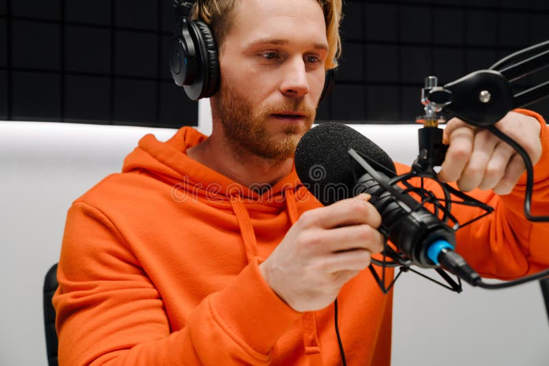 Happy Young Male Radio Host Broadcasting in Studio Stock Image - Image ...