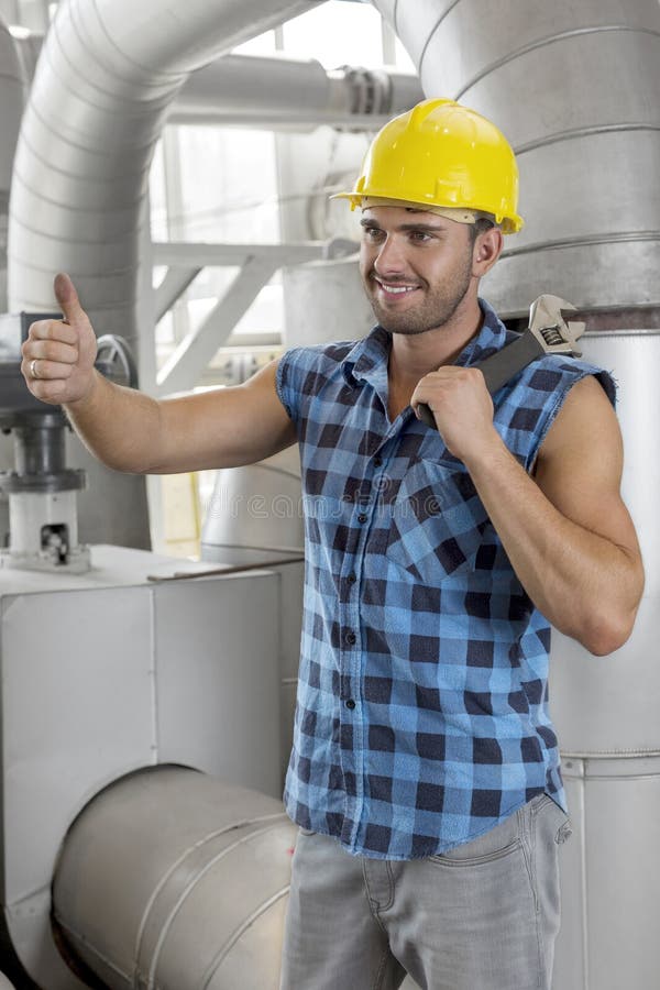Happy Young Male Worker Gesturing Thumbs Up in Industry Stock Image ...