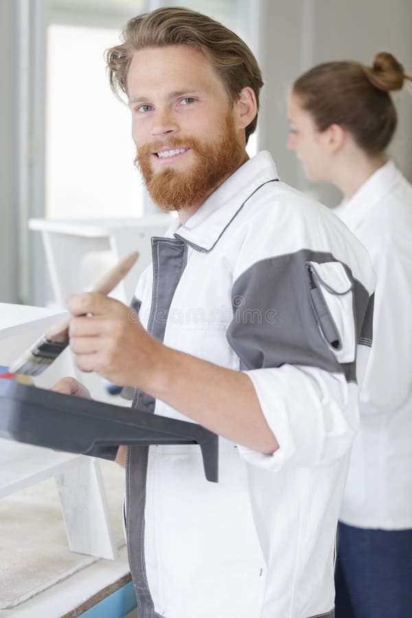 Happy Young Male Worker Looking at Camera Stock Photo - Image of brush ...