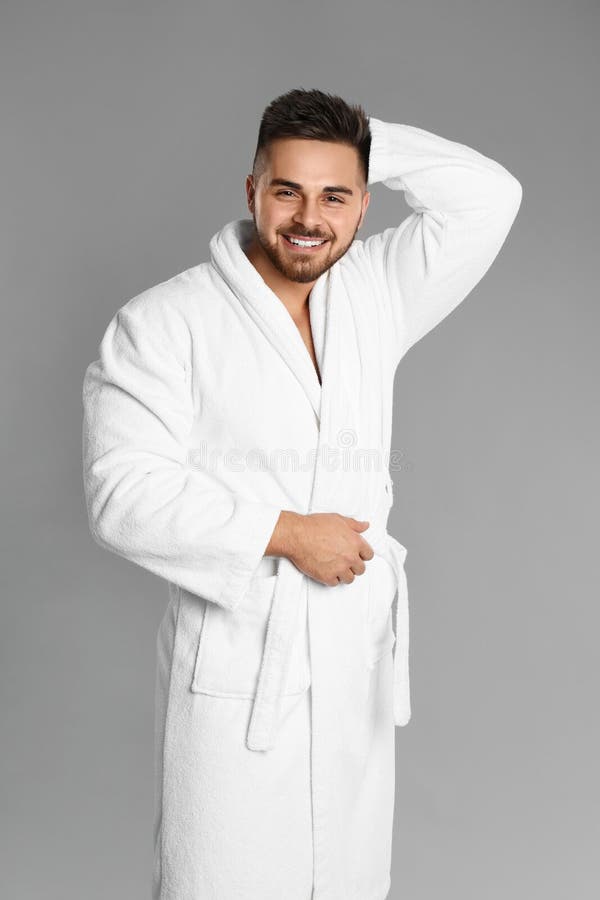 Happy Young Man in Bathrobe on Background Stock Photo - Image of ...