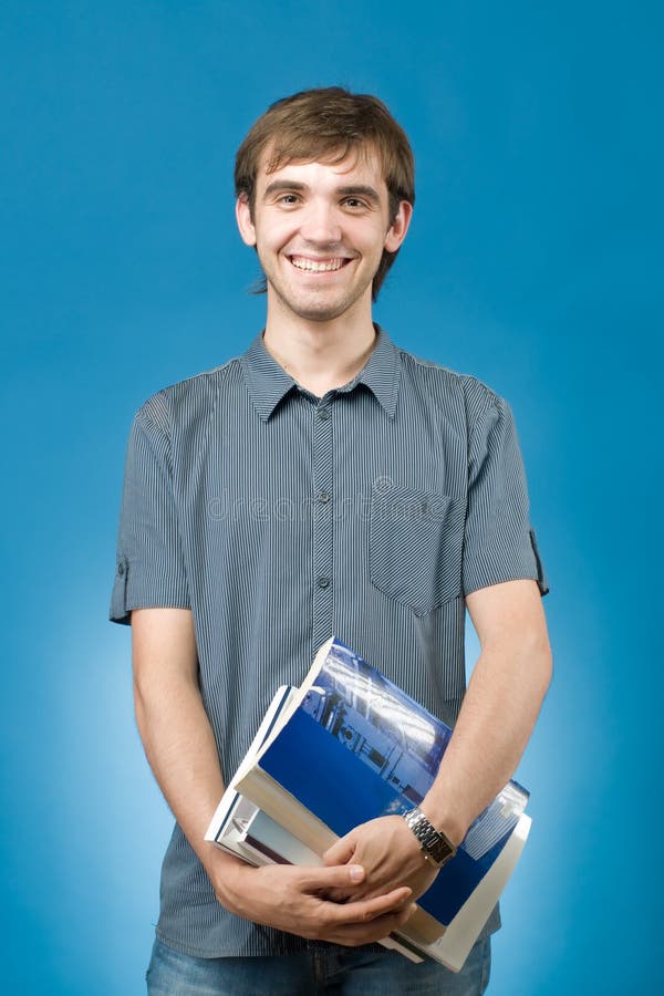 Happy young man with books stock photo. Image of natural - 10223508