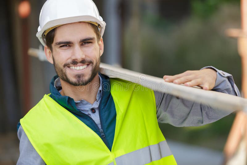 Happy Young Man Carrying Lumber Stock Image - Image of posing, staff ...