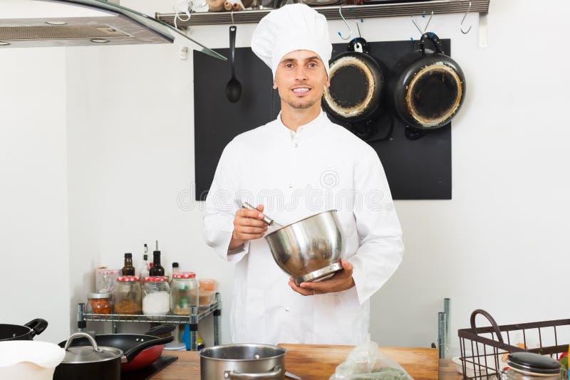 Happy Young Man Chef Cooking Food at Kitchen Stock Image - Image of ...
