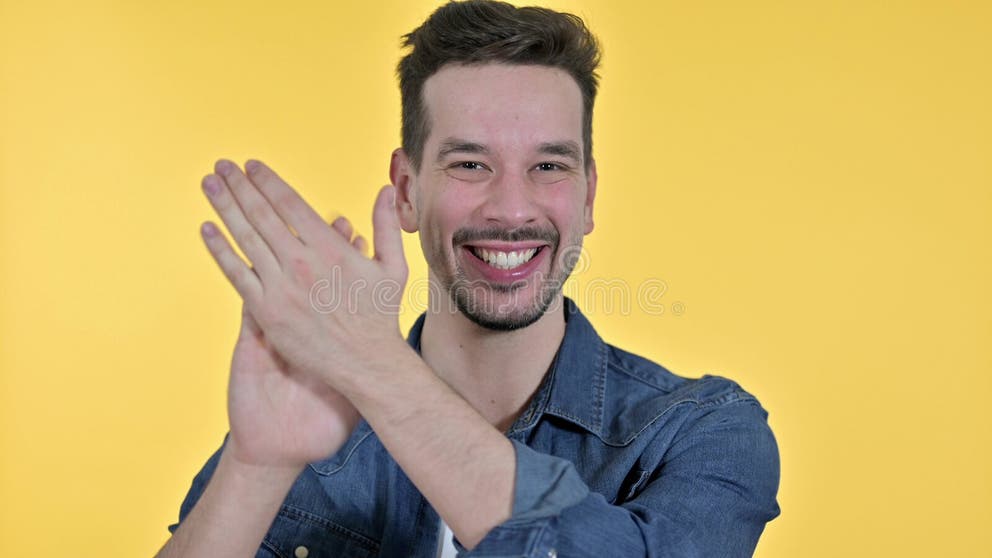 Happy Young Man Clapping, Yellow Background Stock Image - Image of ...