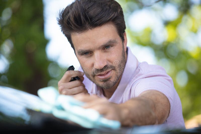 Happy Young Man Cleaning Car with Microfiber Cloth Stock Photo - Image ...