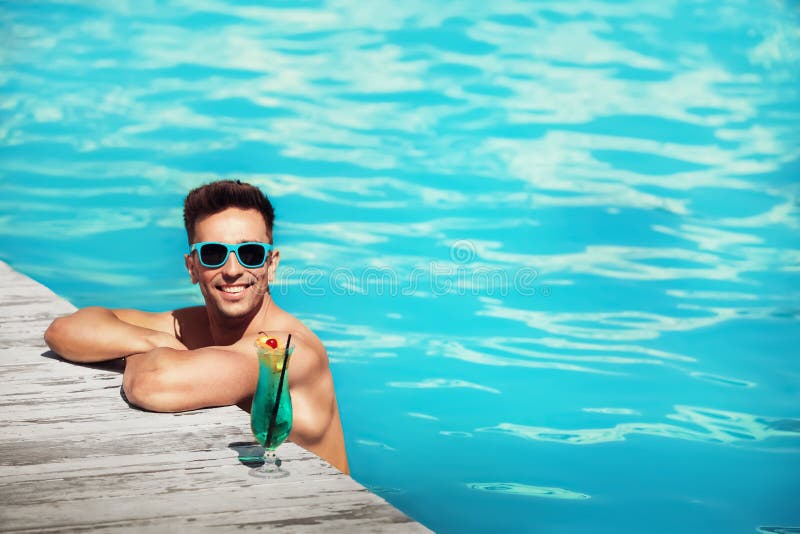 Happy Man with Cocktail in Swimming Pool Stock Image - Image of ...