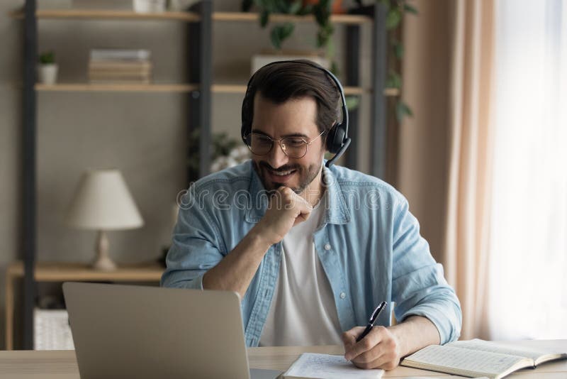 Happy Young Man Listening Educational Online Lecture on Computer. Stock ...