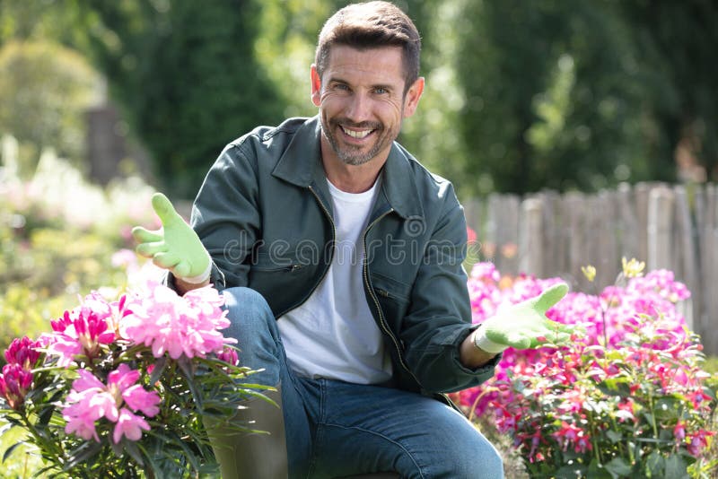 Happy Young Man Gardening in Backyard Stock Photo - Image of gloves ...