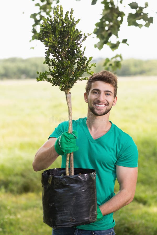 Happy Young Man Gardening for the Community Stock Photo - Image of crop ...