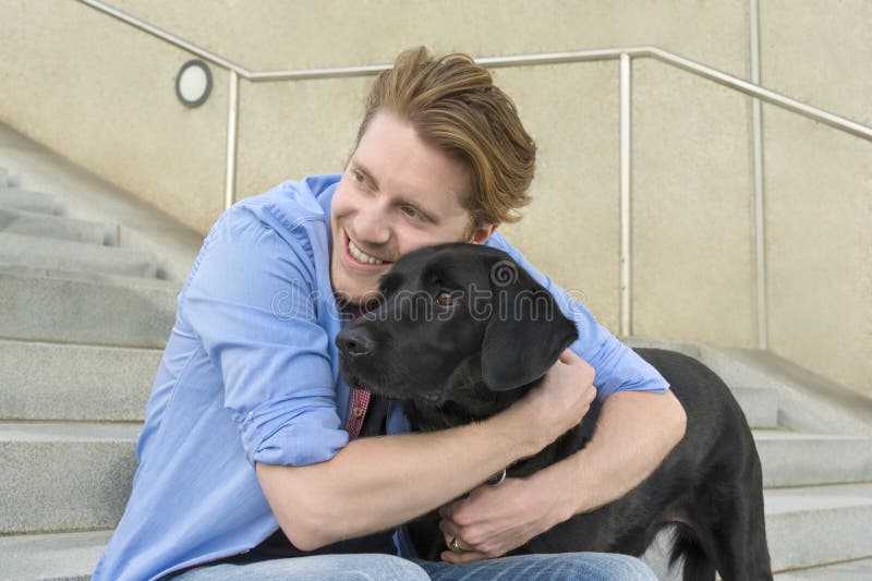 Happy Young Man with His Dog Stock Photo - Image of love, laughing ...