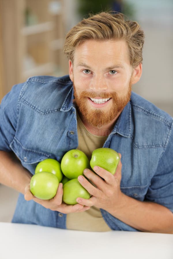 Happy Young Man Holding Green Apples Stock Photo - Image of cheerful ...