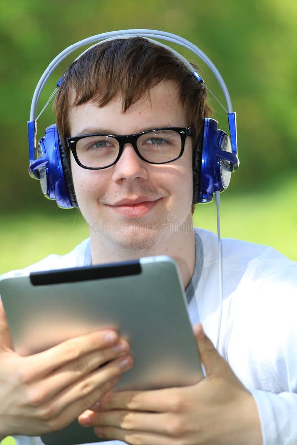 Happy Young Man Holding an Ipad Stock Photo - Image of holding, people ...
