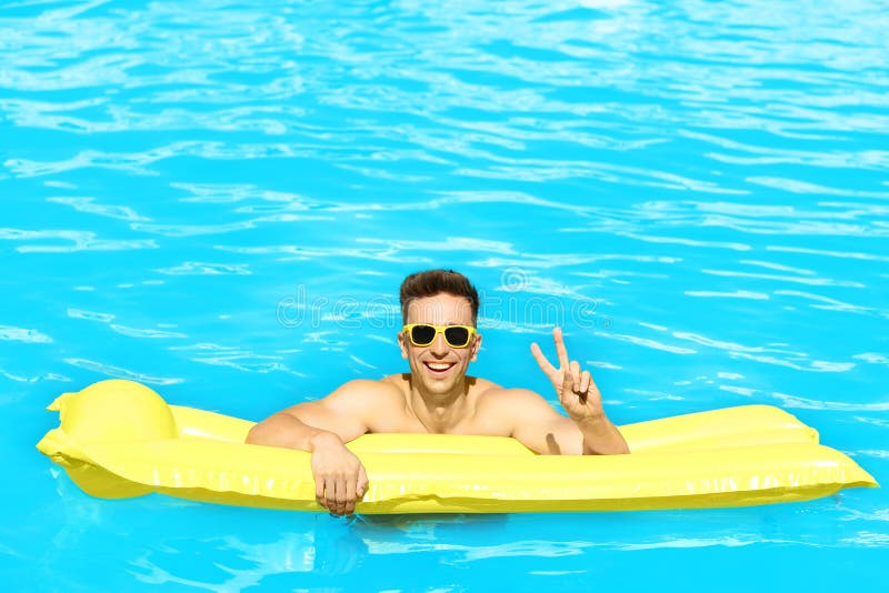 Happy Young Man with Inflatable in Swimming Pool Stock Image - Image of ...