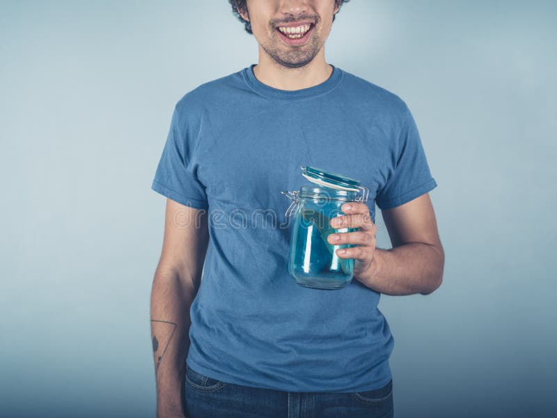 Happy Young Man with Jam Jar Stock Image - Image of ethnic, young: 59296379