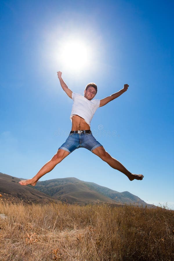 Happy Young Man Jump in the Mountains Stock Image - Image of happiness ...