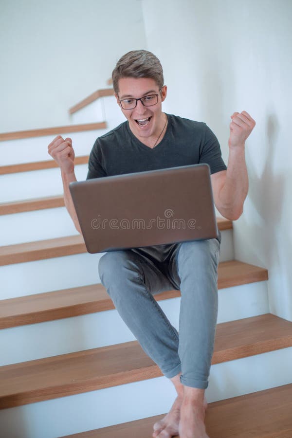 Happy Young Man Looking at His Laptop Screen Stock Image - Image of ...