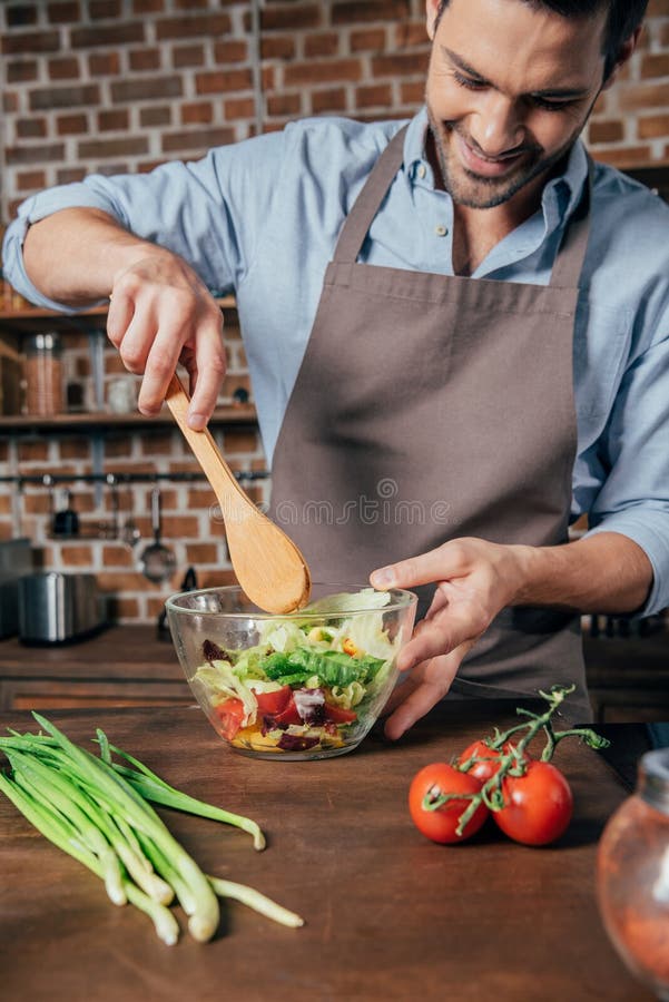 Happy young man mixing stock photo. Image of cook, greens - 118810896