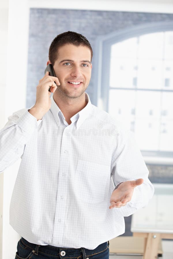 Man Talking on Cell Phone and Wishing Goodluck Stock Photo - Image of ...