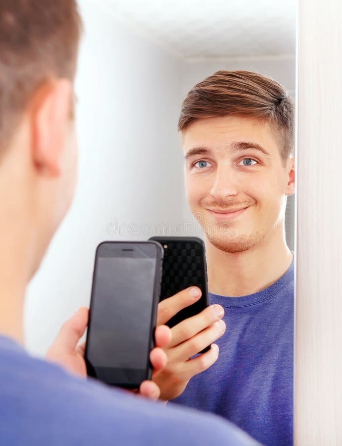 Happy Young Man with a Phone Stock Image - Image of attractive, look ...