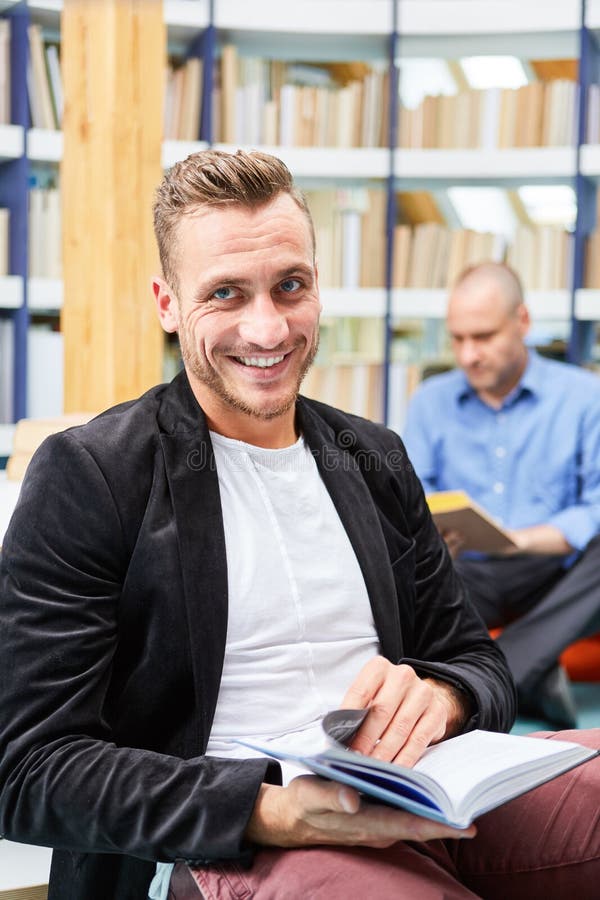 Happy Young Man Reading the Book Stock Photo - Image of happy ... Happy Young Man Reading the Book Stock Photo - Image of happy ...