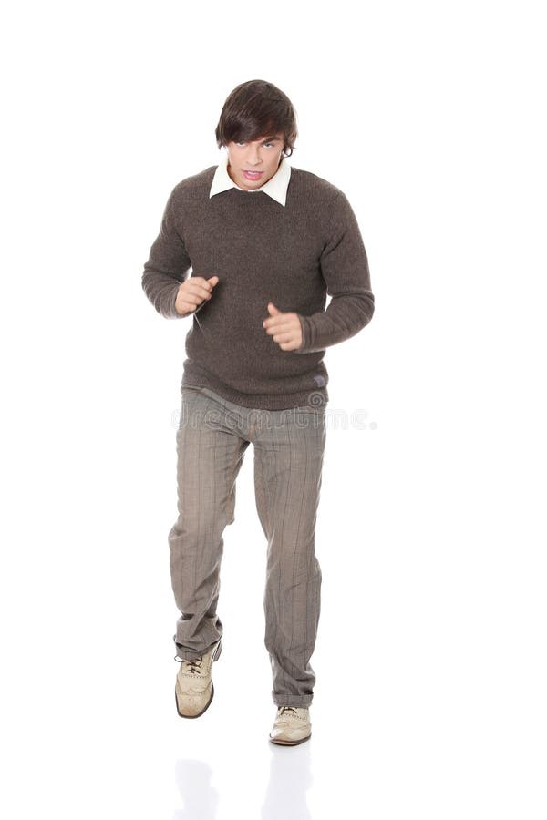 Happy young man running stock photo. Image of handsome - 21388422