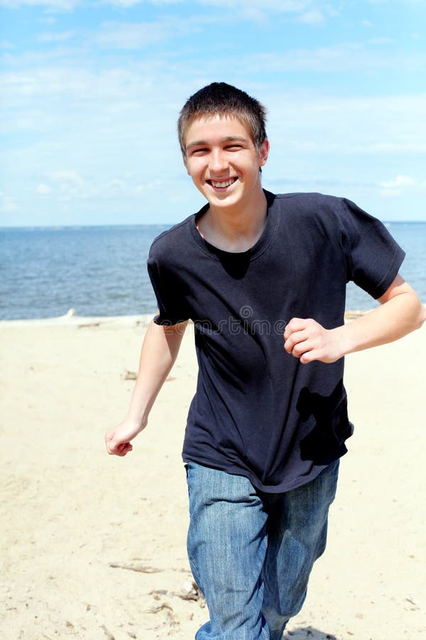 Happy young man running stock photo. Image of expression - 24590226