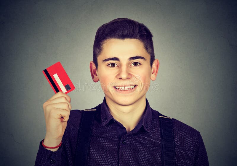 Happy Young Man Showing Credit Card Stock Photo - Image of loan ...