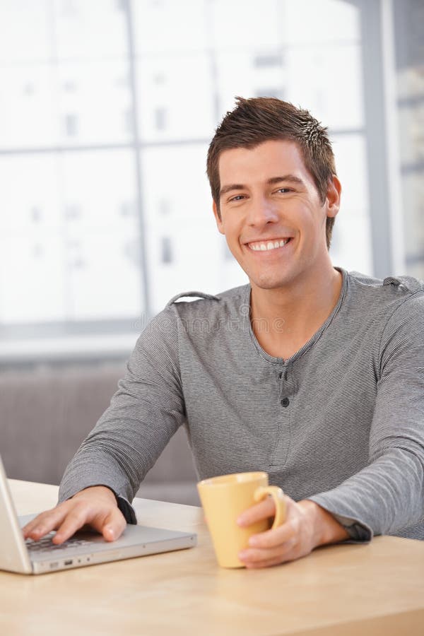 Happy Young Man Sitting at Table Stock Image - Image of happiness, face ...