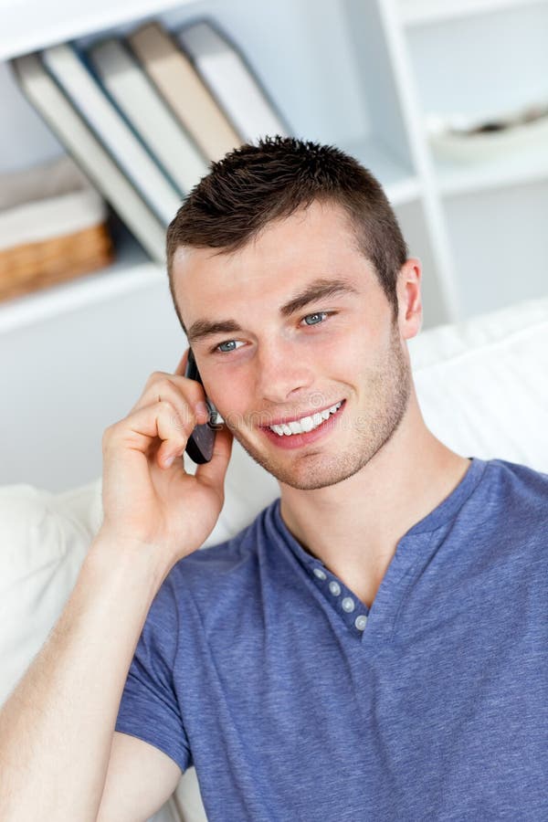 Happy Young Man Talking on Phone Sitting on a Sofa Stock Image - Image ...